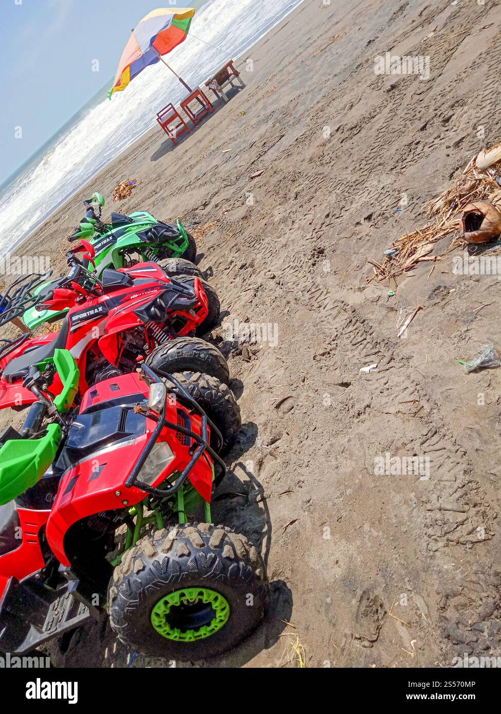 Atv on the beach seaside Stock Photo - Alamy