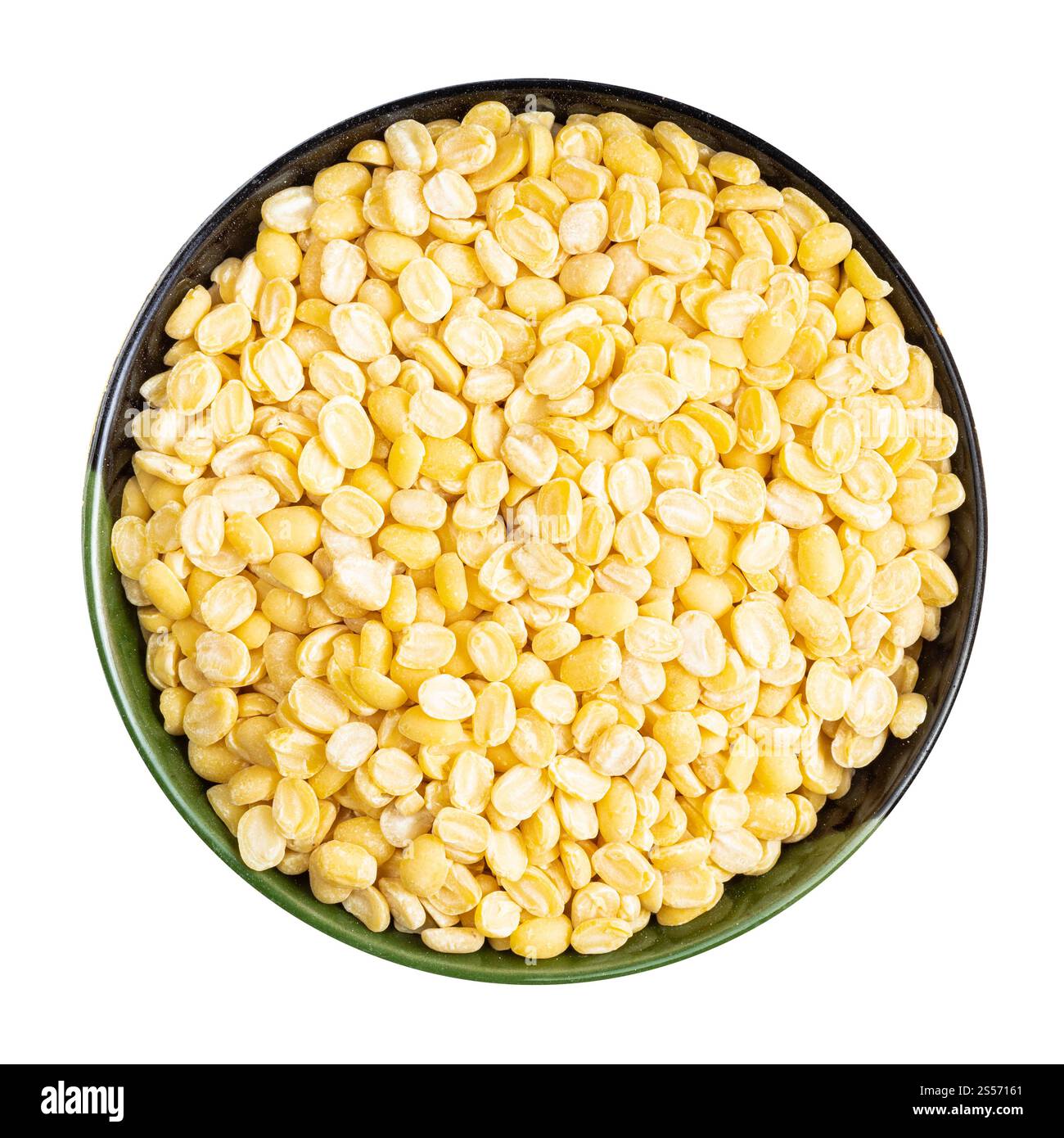 top view of raw moong dal (split green mung) beans in round bowl ...