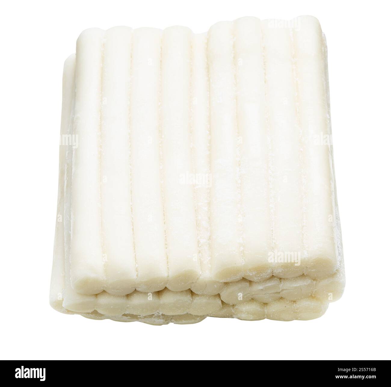 raw frozen tteokbokki (korean rice cakes) isolated on white background ...