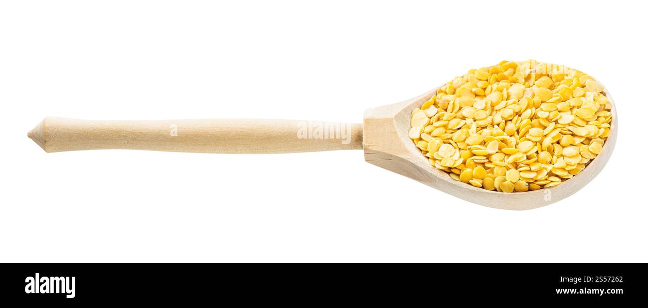 wooden spoon with split yellow lentils isolated on white background Stock Photo - Alamy