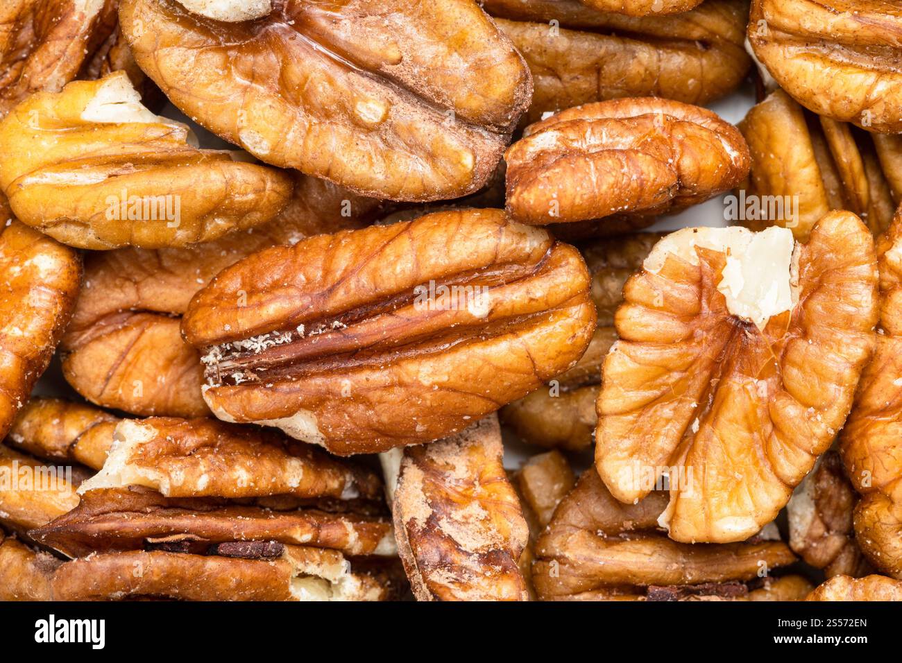 food background - many shelled pecan nuts Stock Photo - Alamy