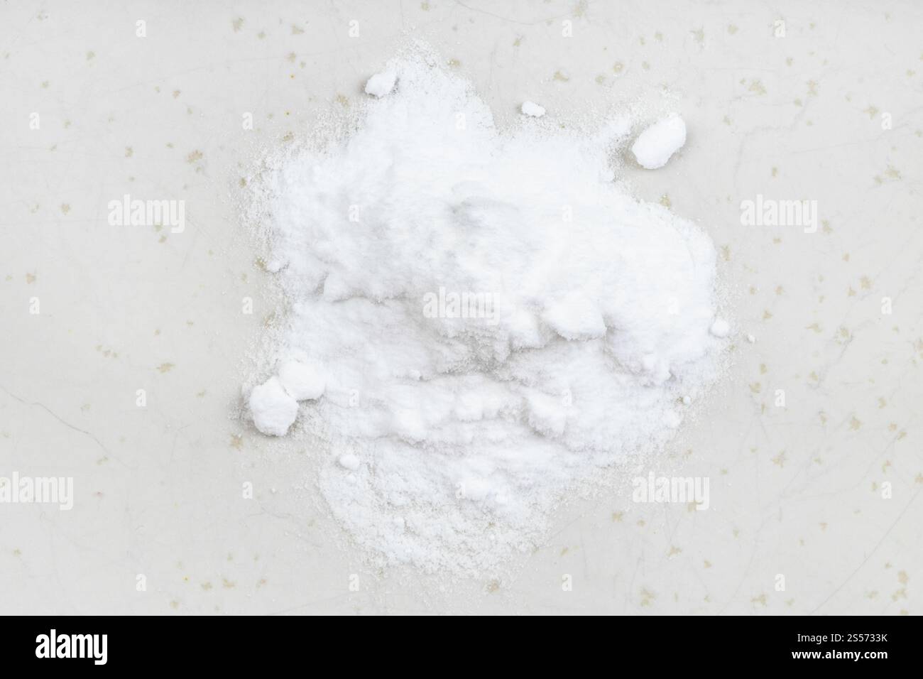 top view of pile of sodium bicarbonate close up on gray ceramic plate ...