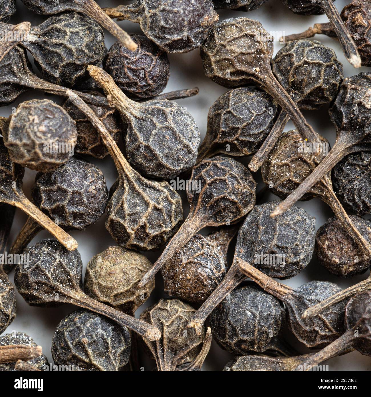 square food background - tailed pepper (cubeb) close up Stock Photo - Alamy