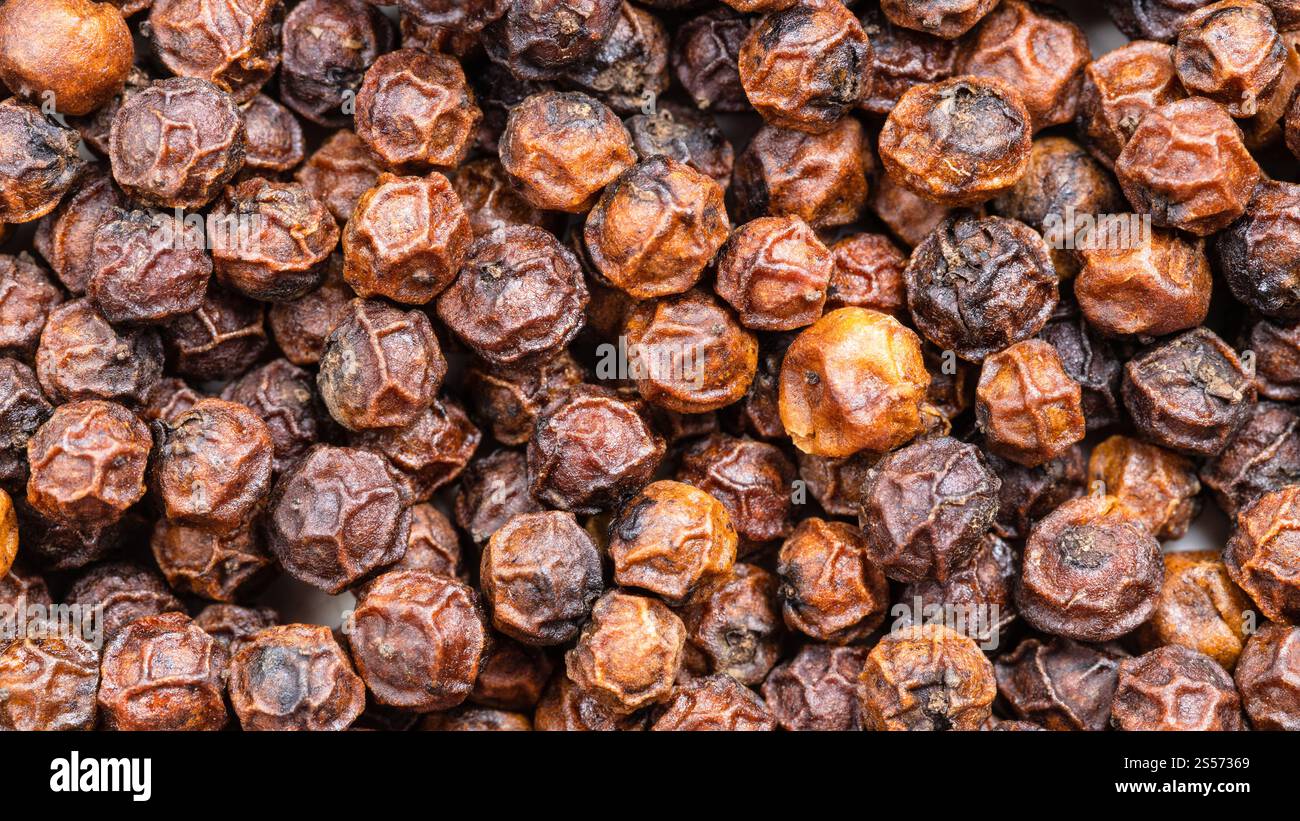 panoramic food background - many red kampot peppercorns Stock Photo - Alamy