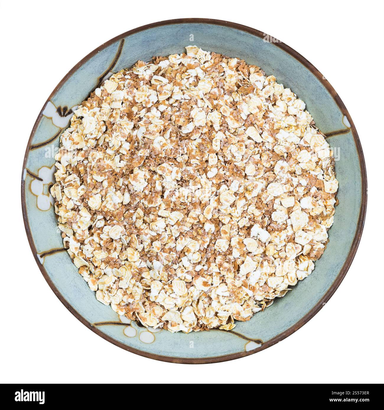 top view of oat flakes with wheat bran in round bowl isolated on white ...