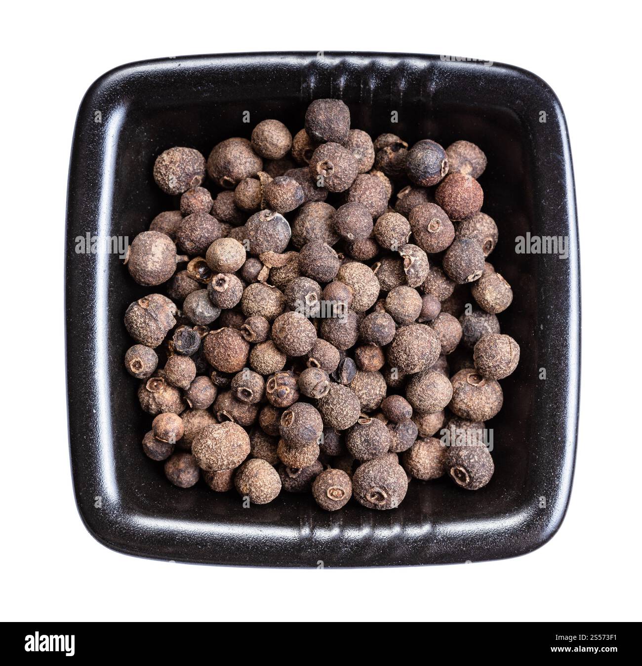 top view of allspice jamaica pepper in black bowl isolated on white ...