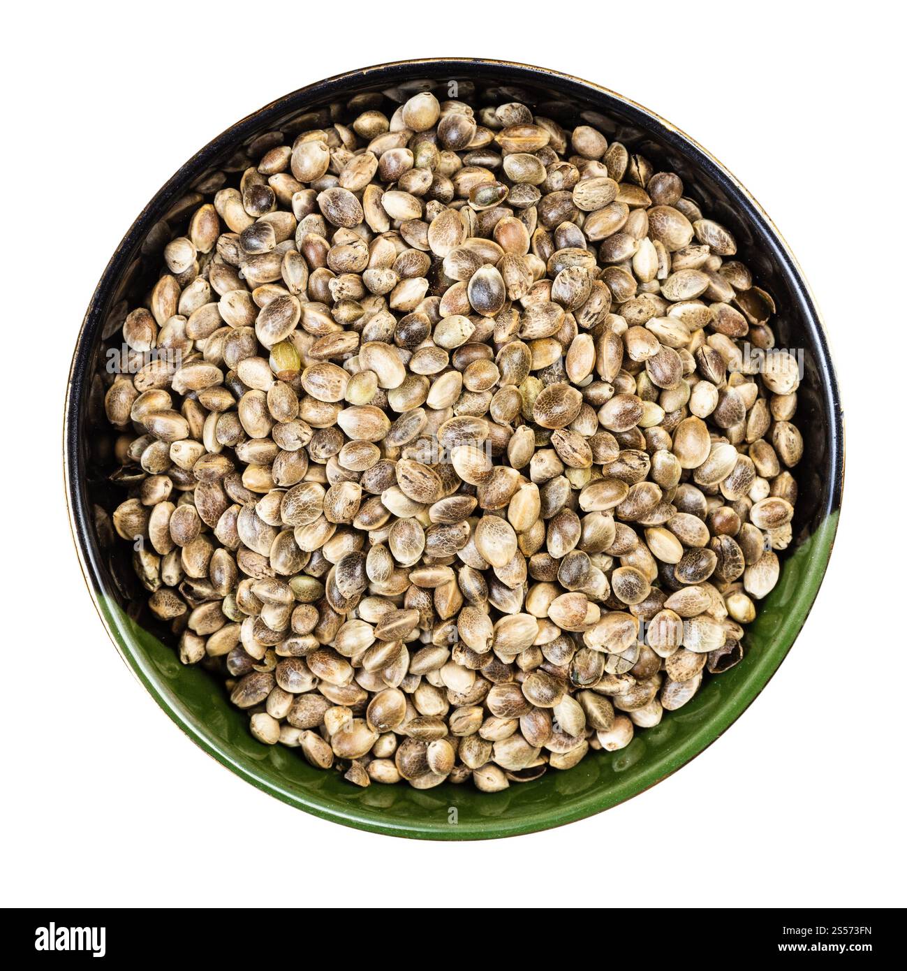top view of unpeeled hemp seeds in round bowl isolated on white ...