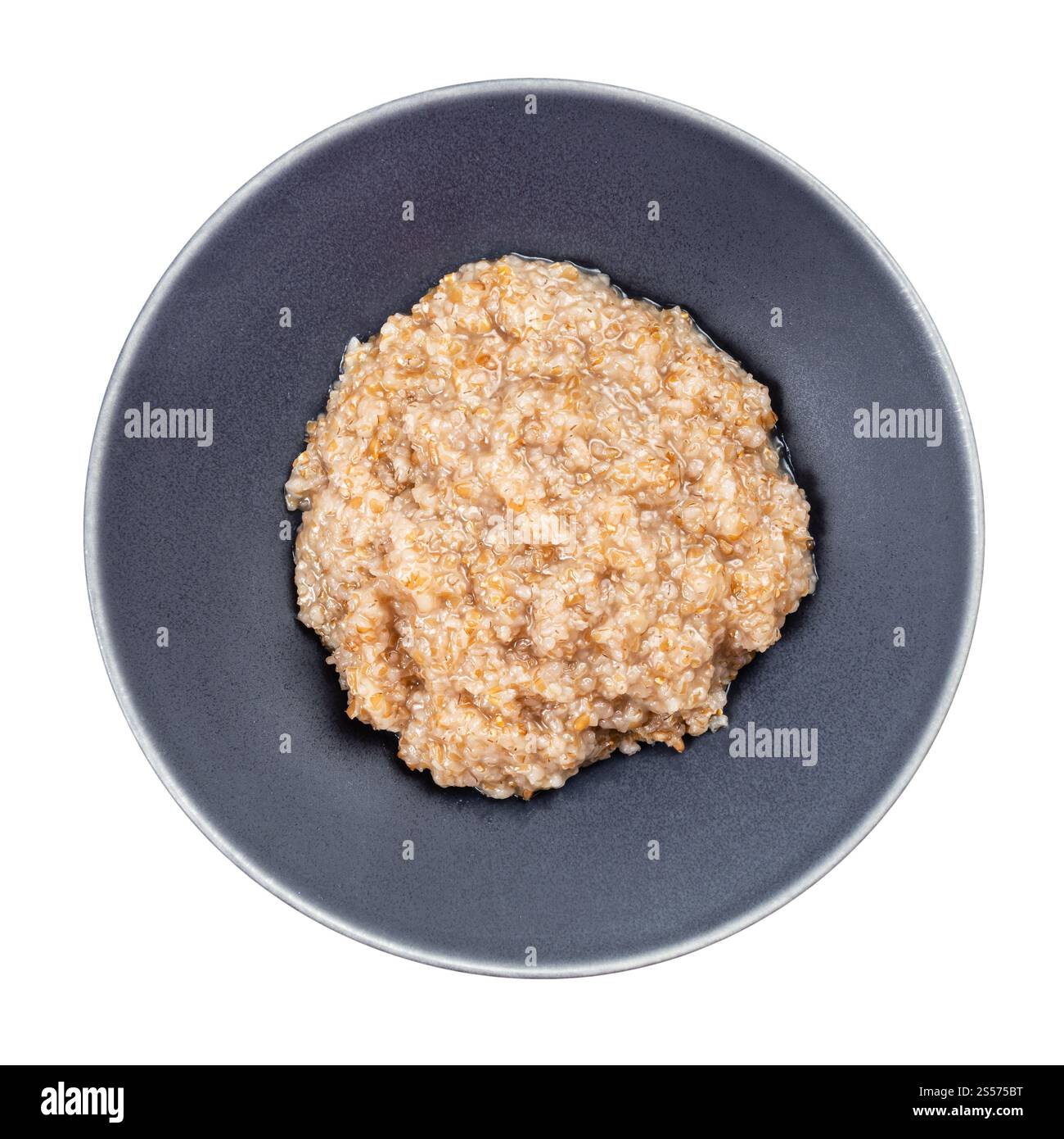 top view of boiled porridge from crushed rye groats in gray bowl ...