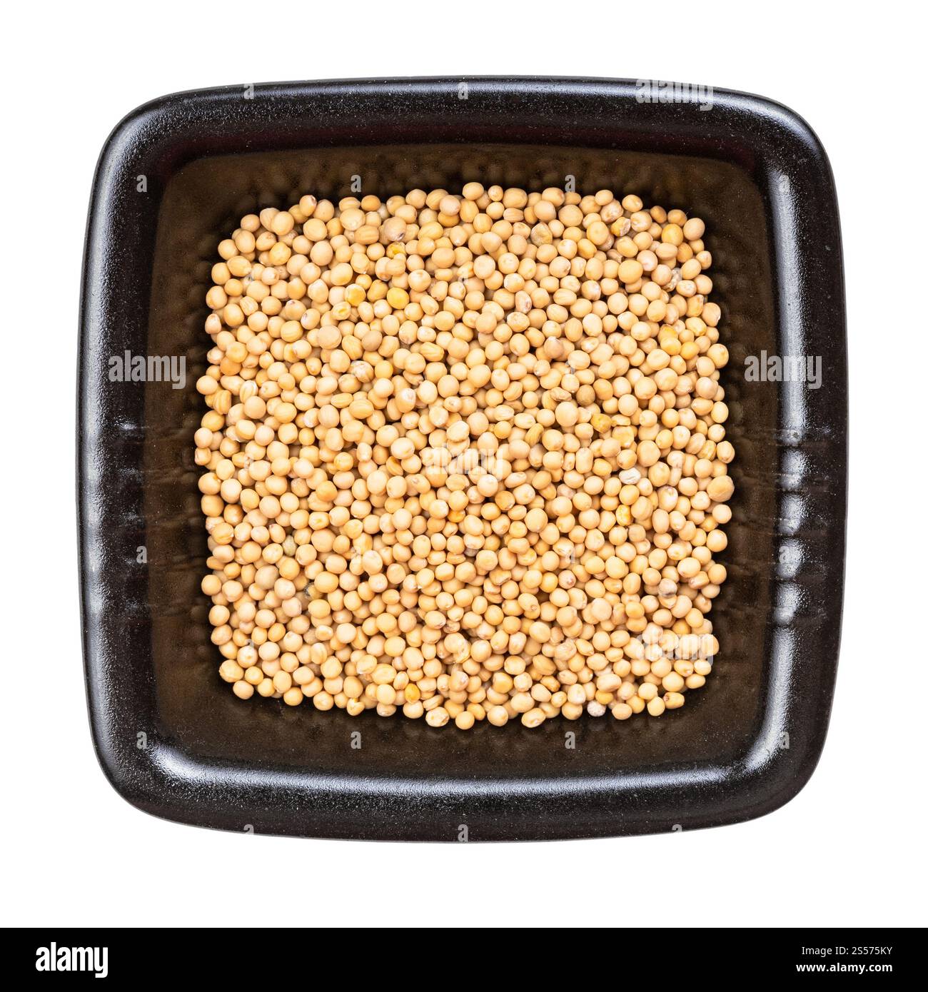 top view of white mustard seeds (sinapis alba) in black bowl isolated ...