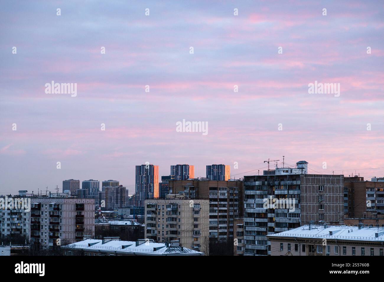 pink clouds in blue sky over residential district in Moscow city at ...