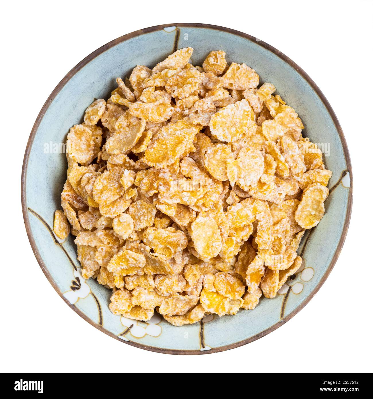 top view of sugar coated cornflakes in round bowl isolated on white ...