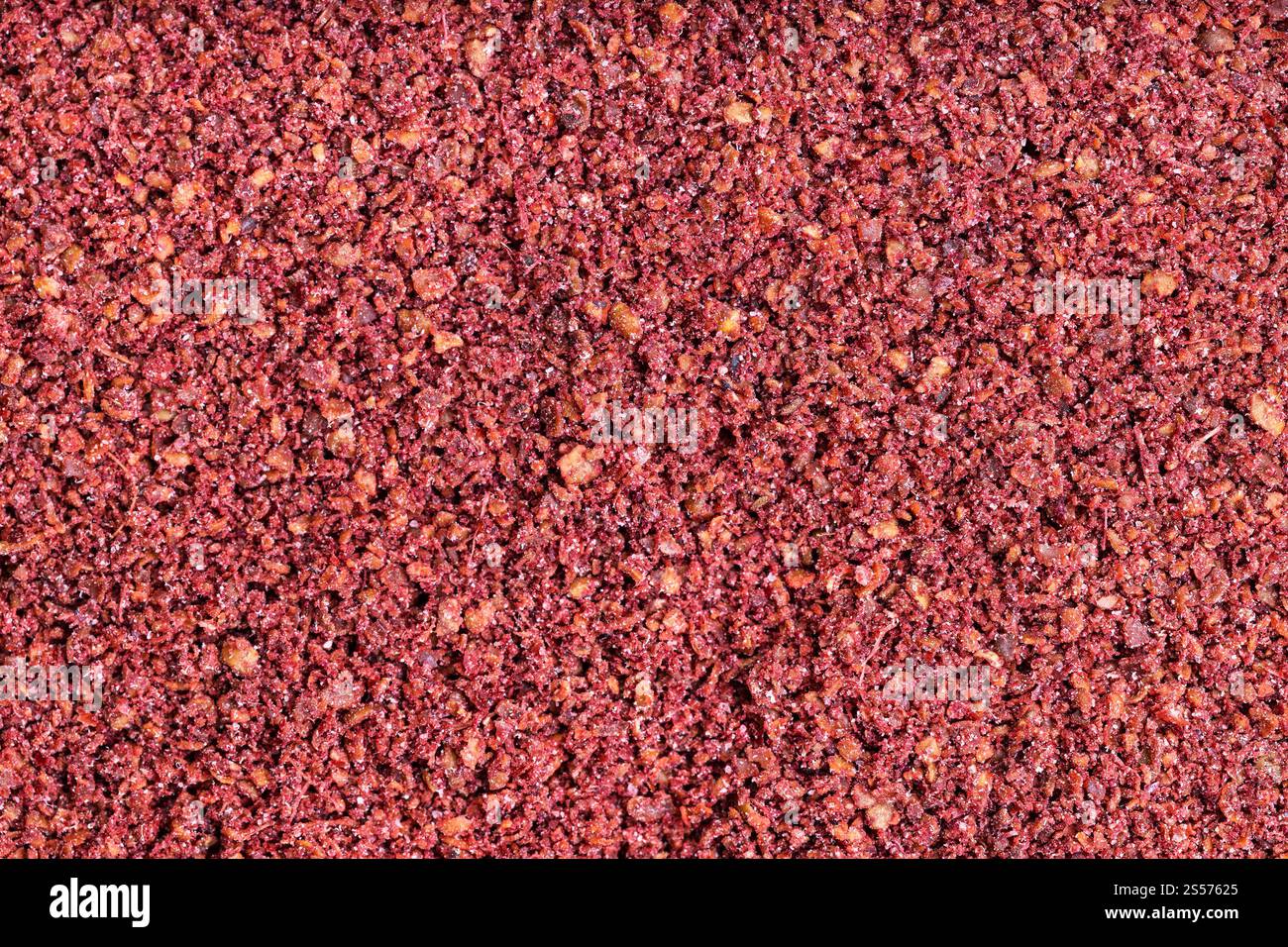 food background - red ground sumac spice Stock Photo - Alamy