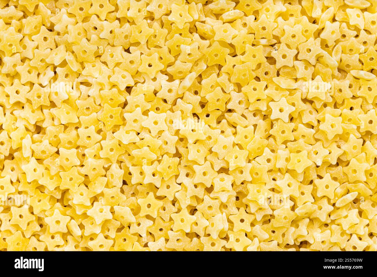 food background - uncooked dry stelline pastina Stock Photo - Alamy