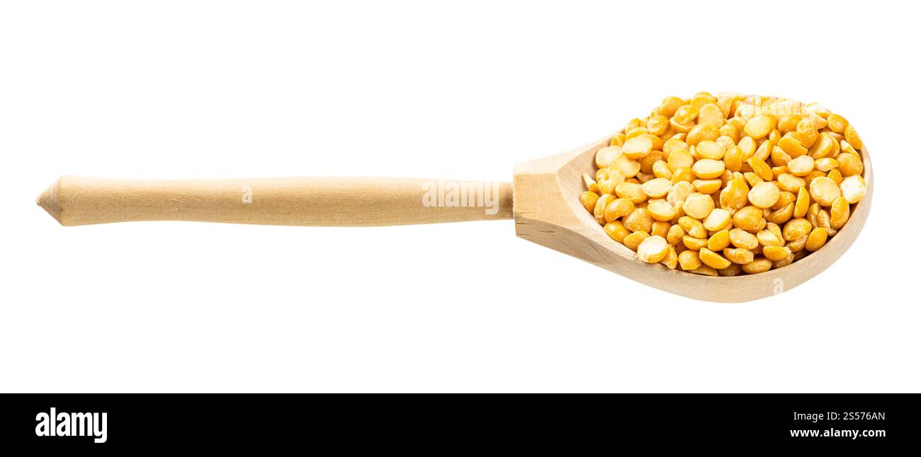 wooden spoon with dried split yellow peas isolated on white background ...