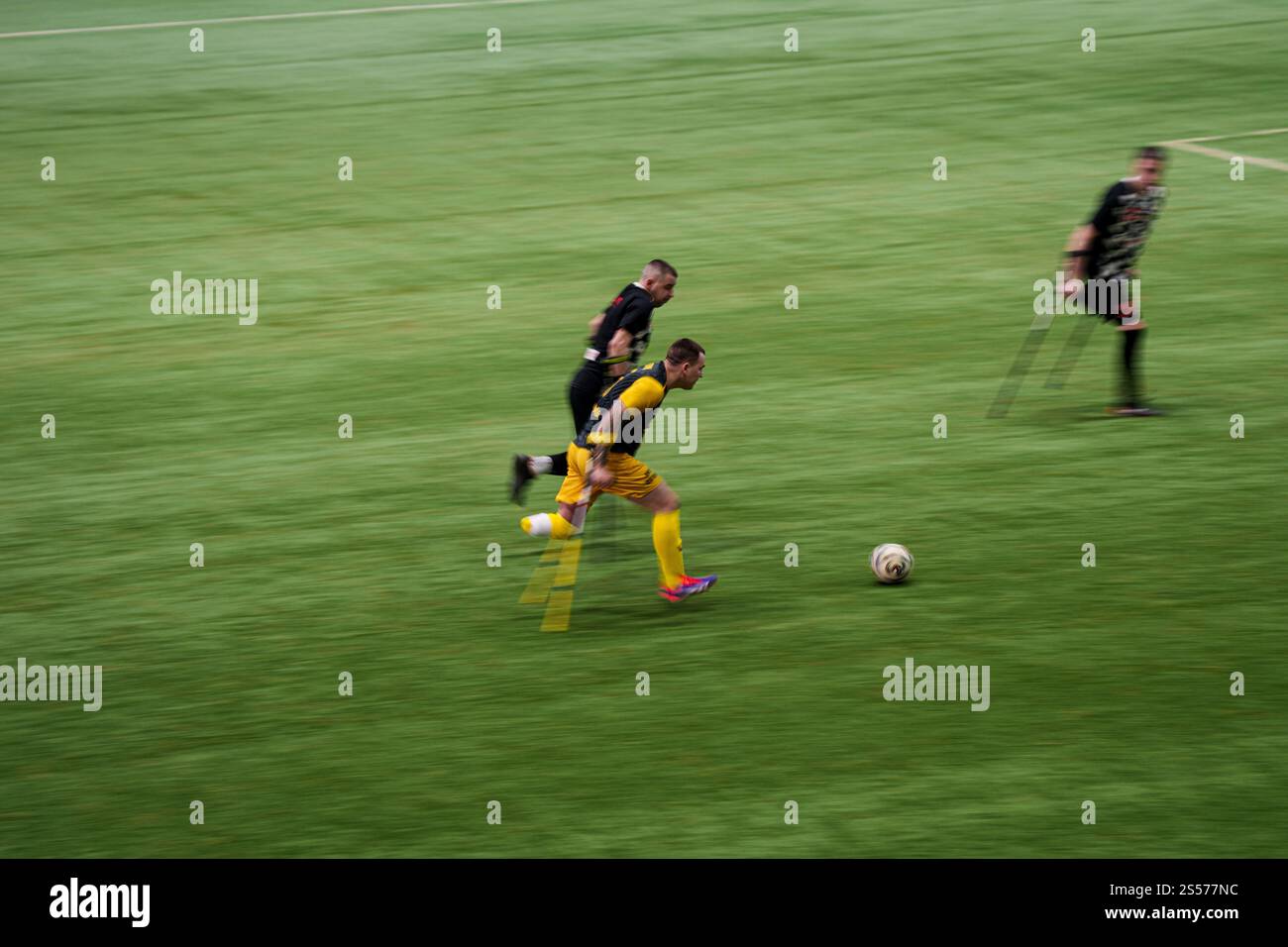 Soccer players of AMP FC Kyiv and MSK Dnipro play during the first ...