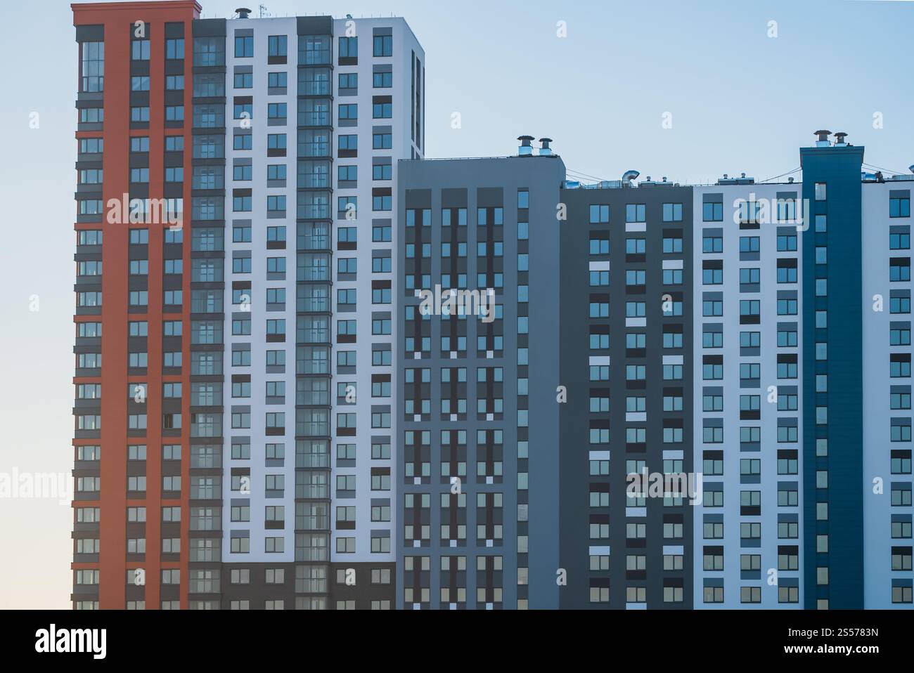 Colorful high-rise residential buildings filling the skyline create a ...