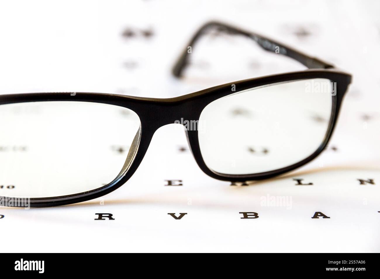 Glasses on eye chart. Optical device background. Glasses on eye chart ...