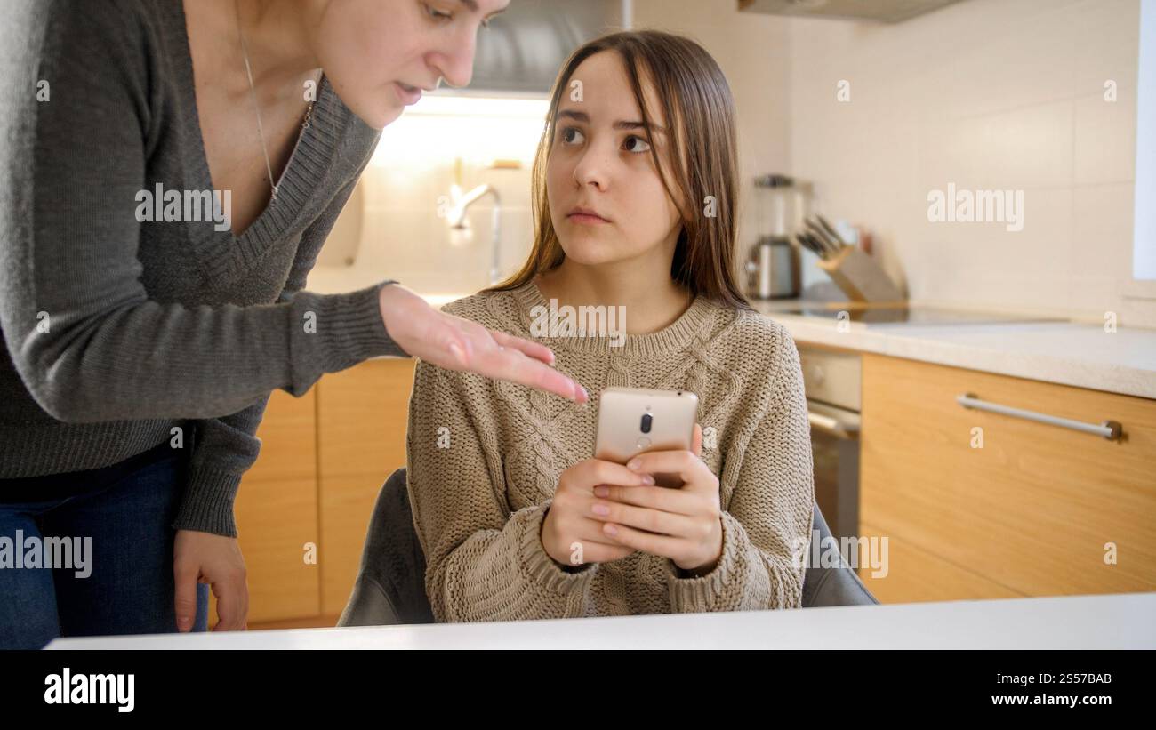 Teenage girl crying after mother shouting at her and taking away ...