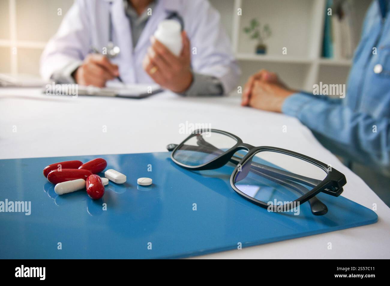 Medicine Doctor hand holding pack of different tablet blisters for ...