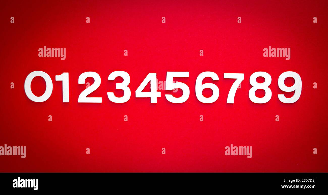 Mathematics background made with solid numbers from 1 to 9 on a red ...