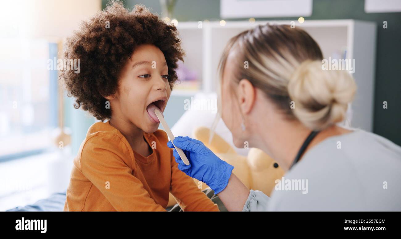 Doctor, child and check throat for diagnosis, tonsils and hospital for ...