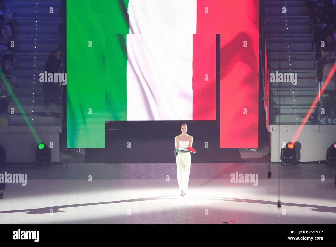 Turin, Italy. 13th Jan, 2025. Carolina Kostner delivers the Italy flag ...