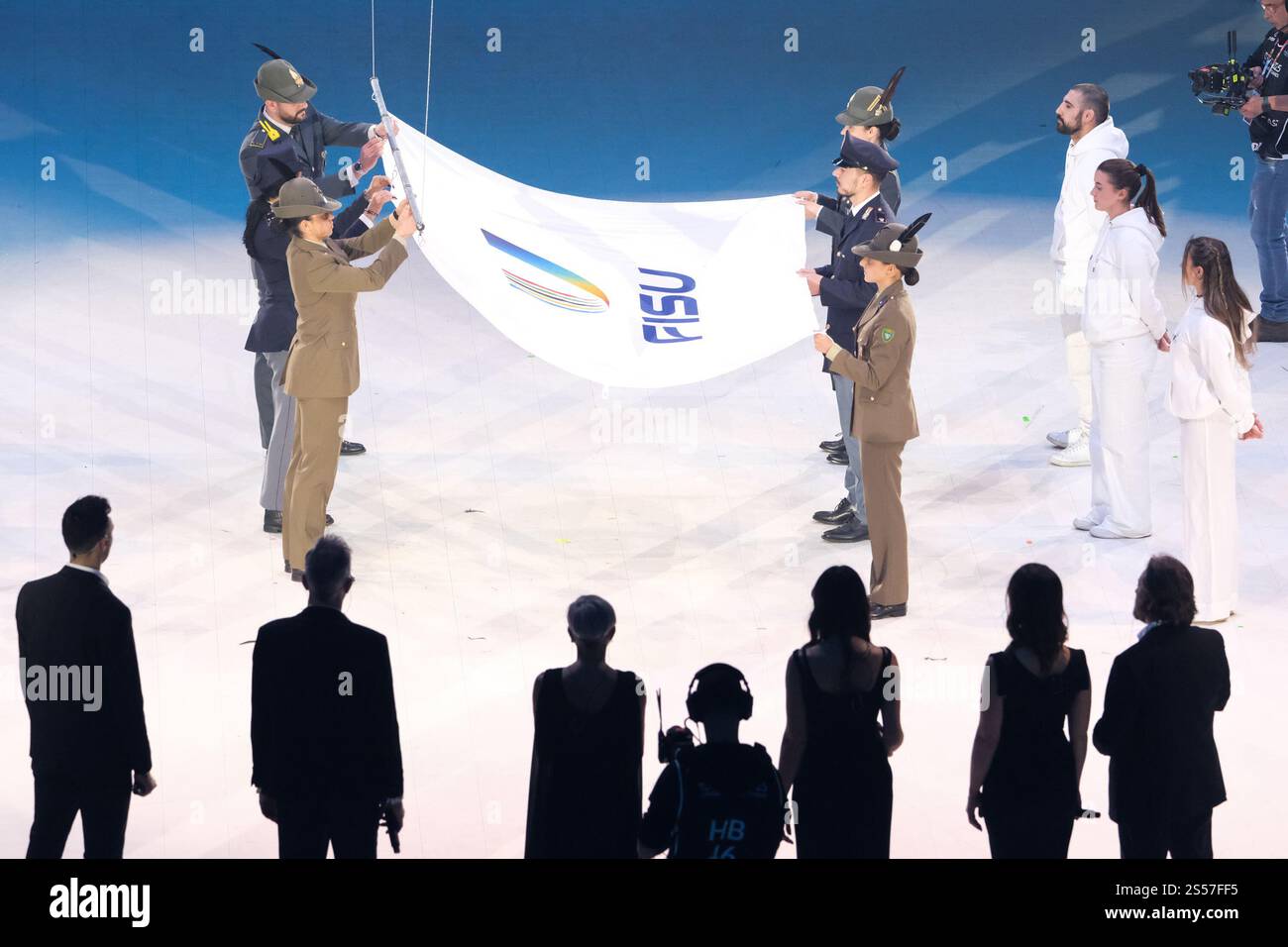 Turin, Italy. 13th Jan, 2025. The police hoist the FISU flag during the ...