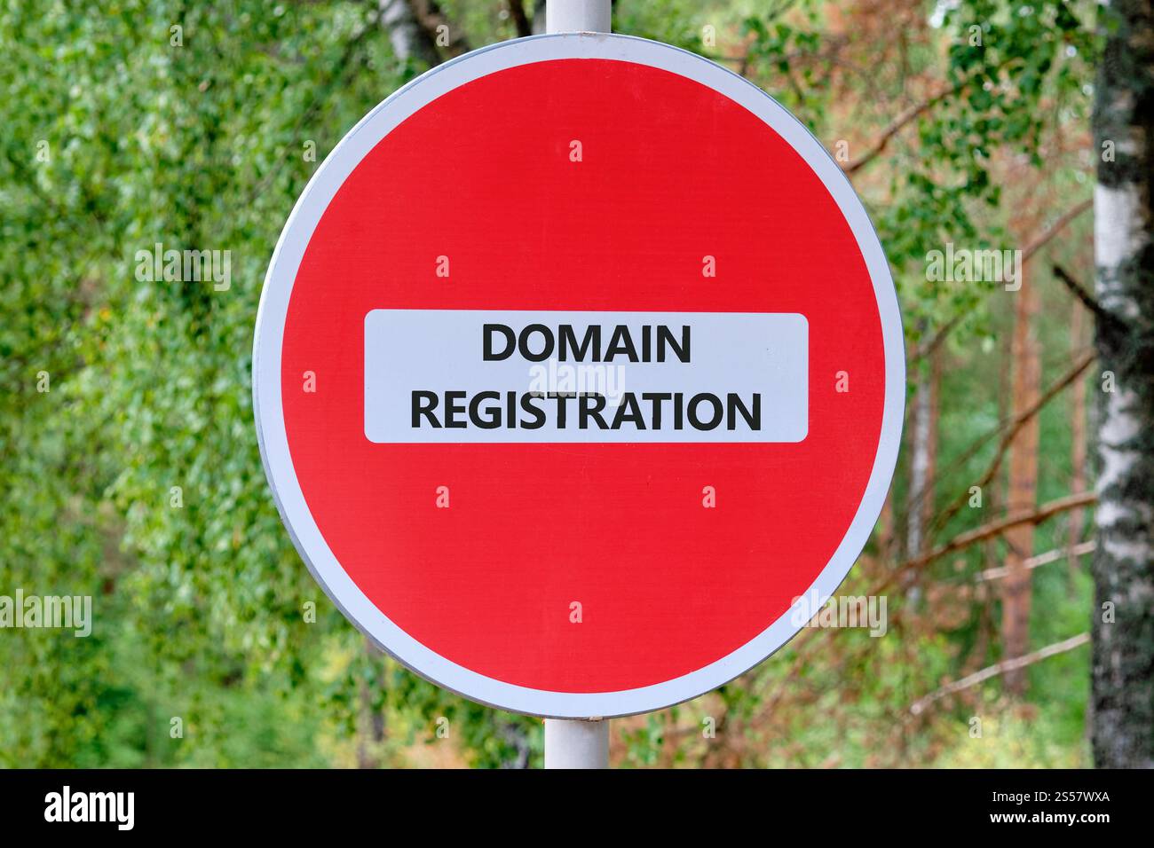 Sign indicates domain registration in a wooded area, highlighting ...