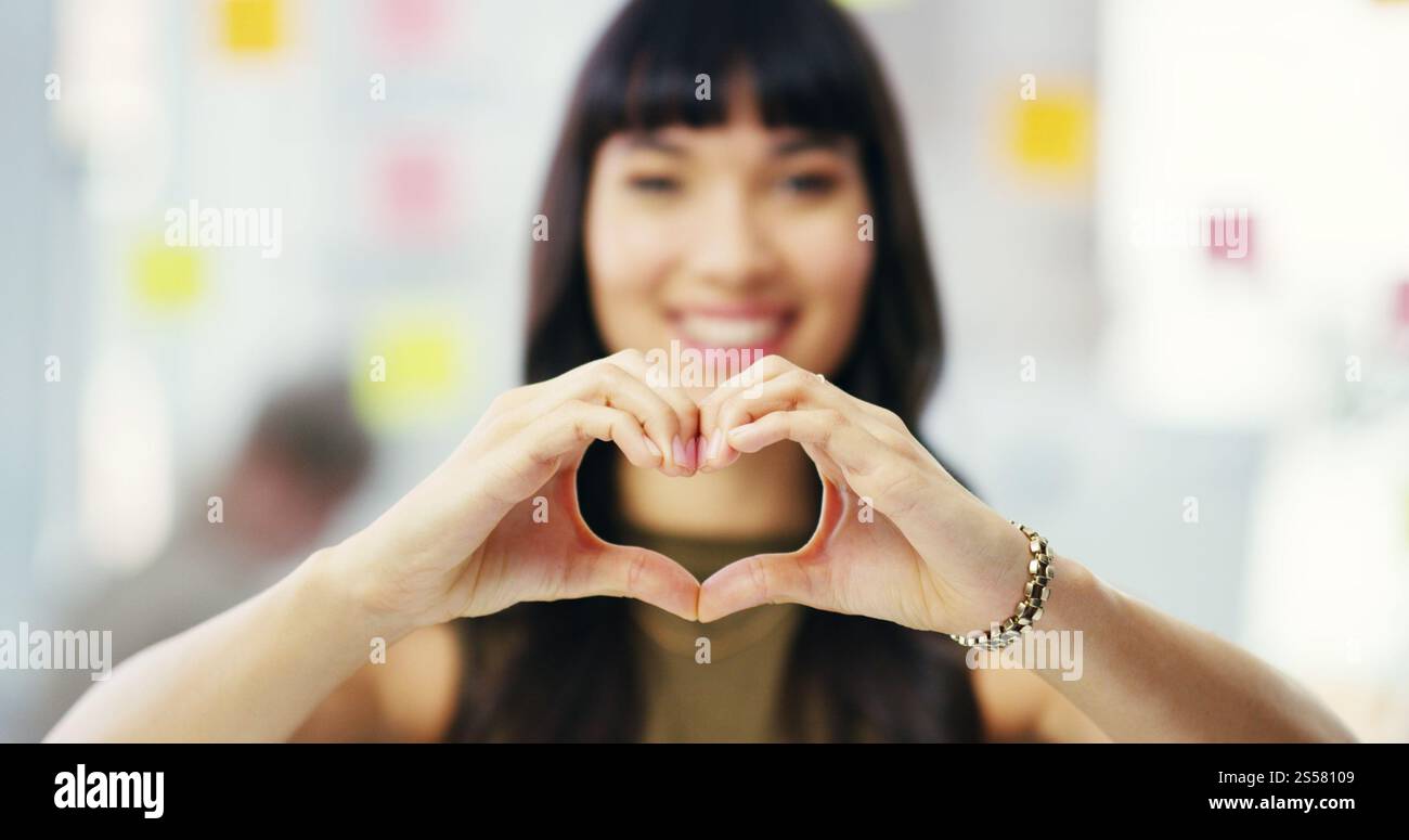 Woman, heart hands and professional in office, motivation and love for ...