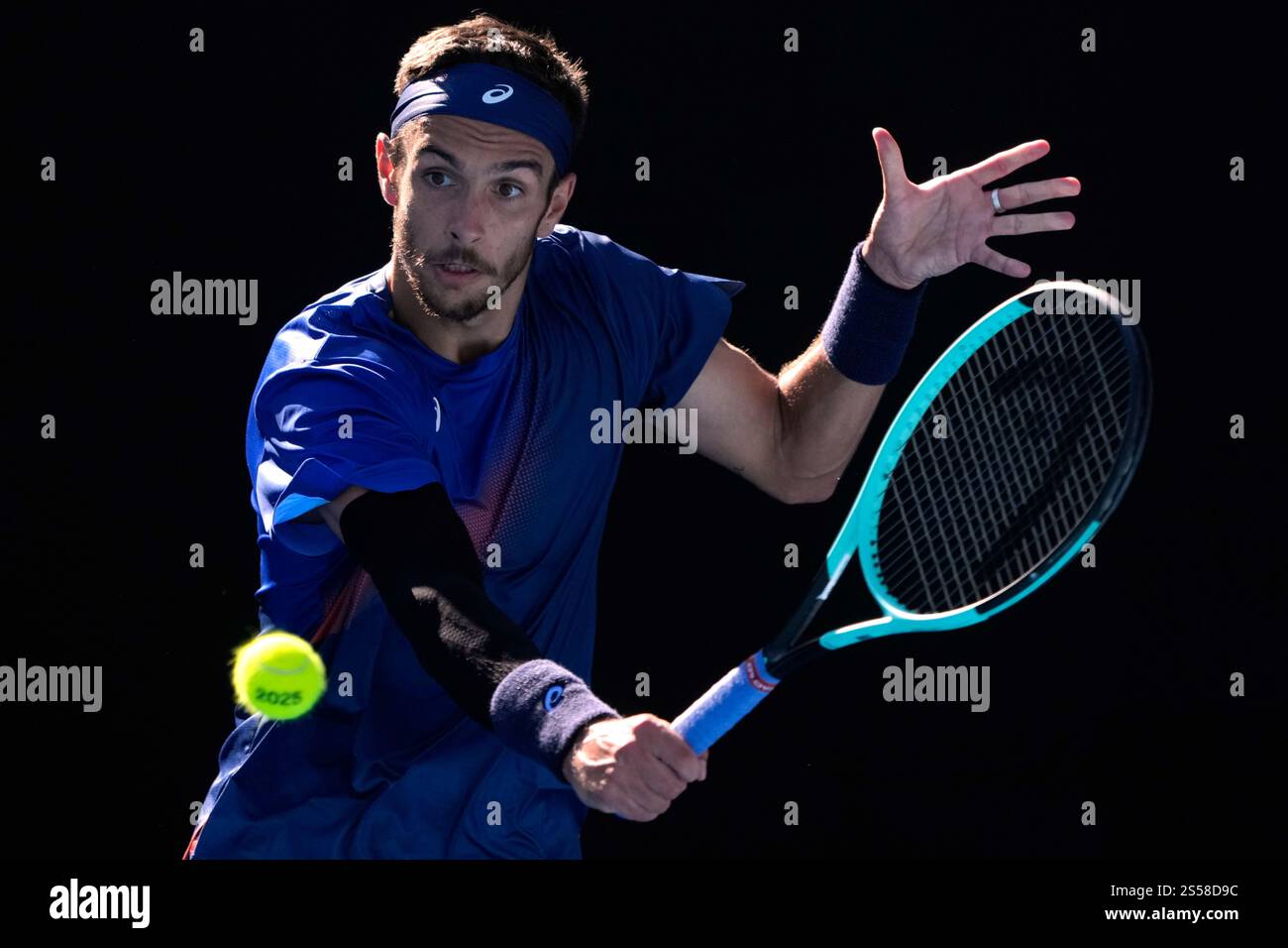 Lorenzo Musetti of Italy plays a backhand return to Matteo Arnaldi of ...