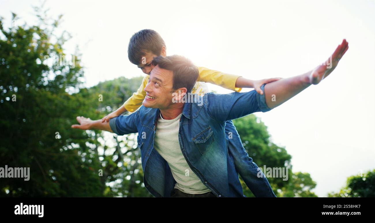 Dad, piggyback and outdoor flying with son, fantasy adventure and ...