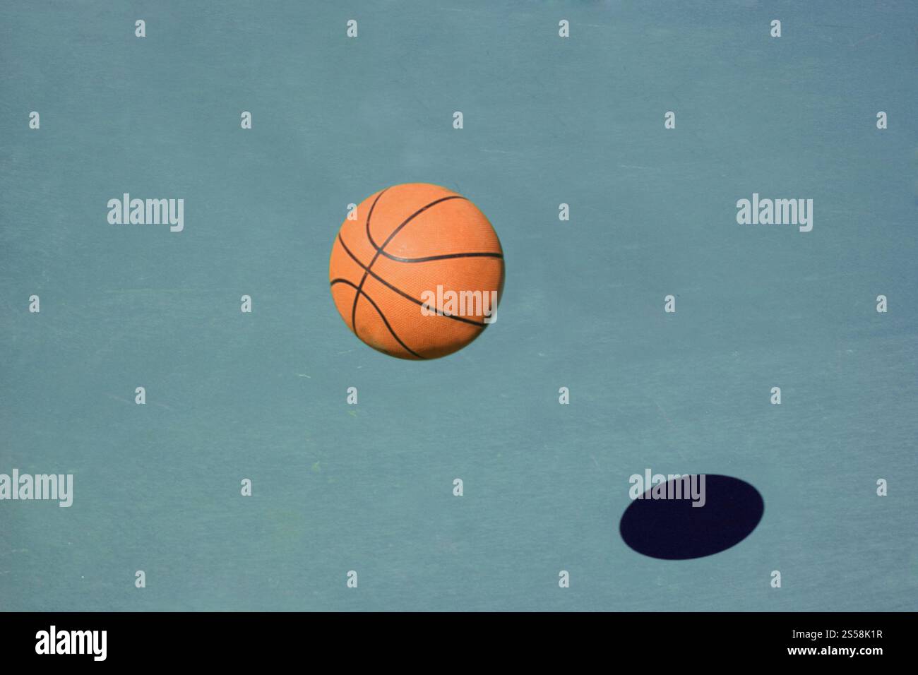 Bouncing Basketball ball in asphalt. Bouncing Basketball Stock Photo ...