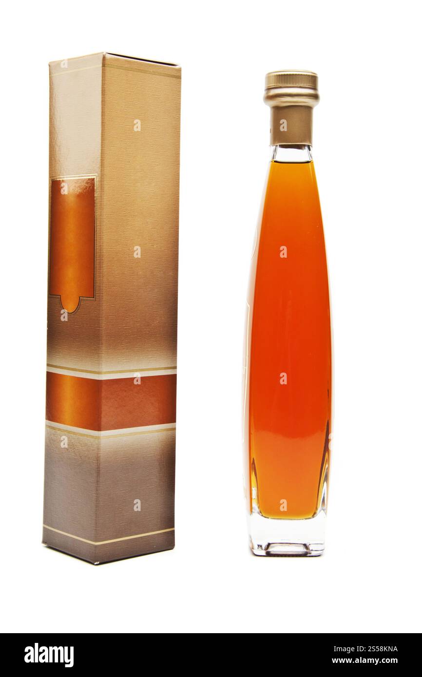 Cognac in bottle without labels isolated on white background. Exclusive bottle of cognac with ...