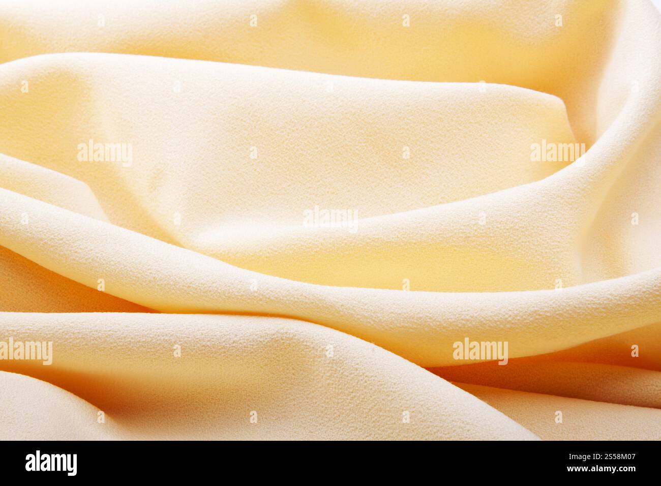 background of bright yellow silk with waves texture. background of ...