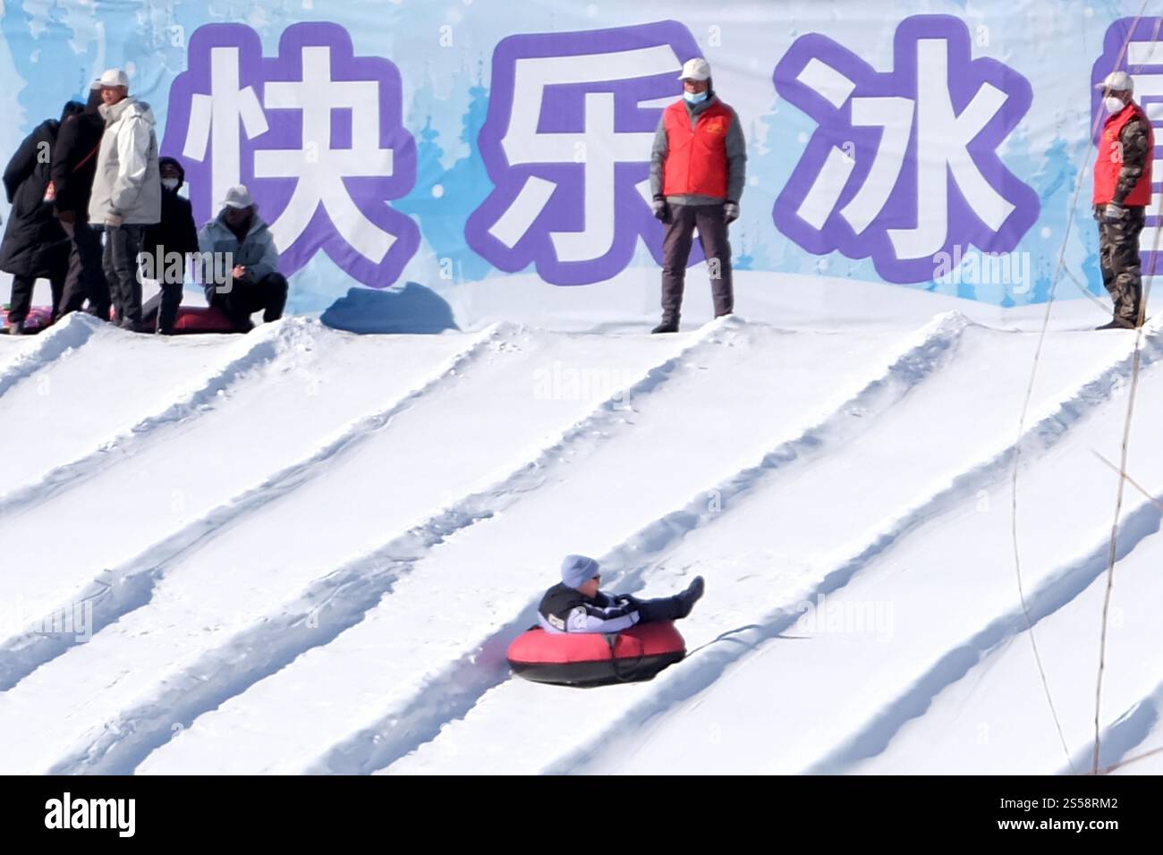 Tourists experience ice and snow sports at a park in Beijing, China, 10 ...