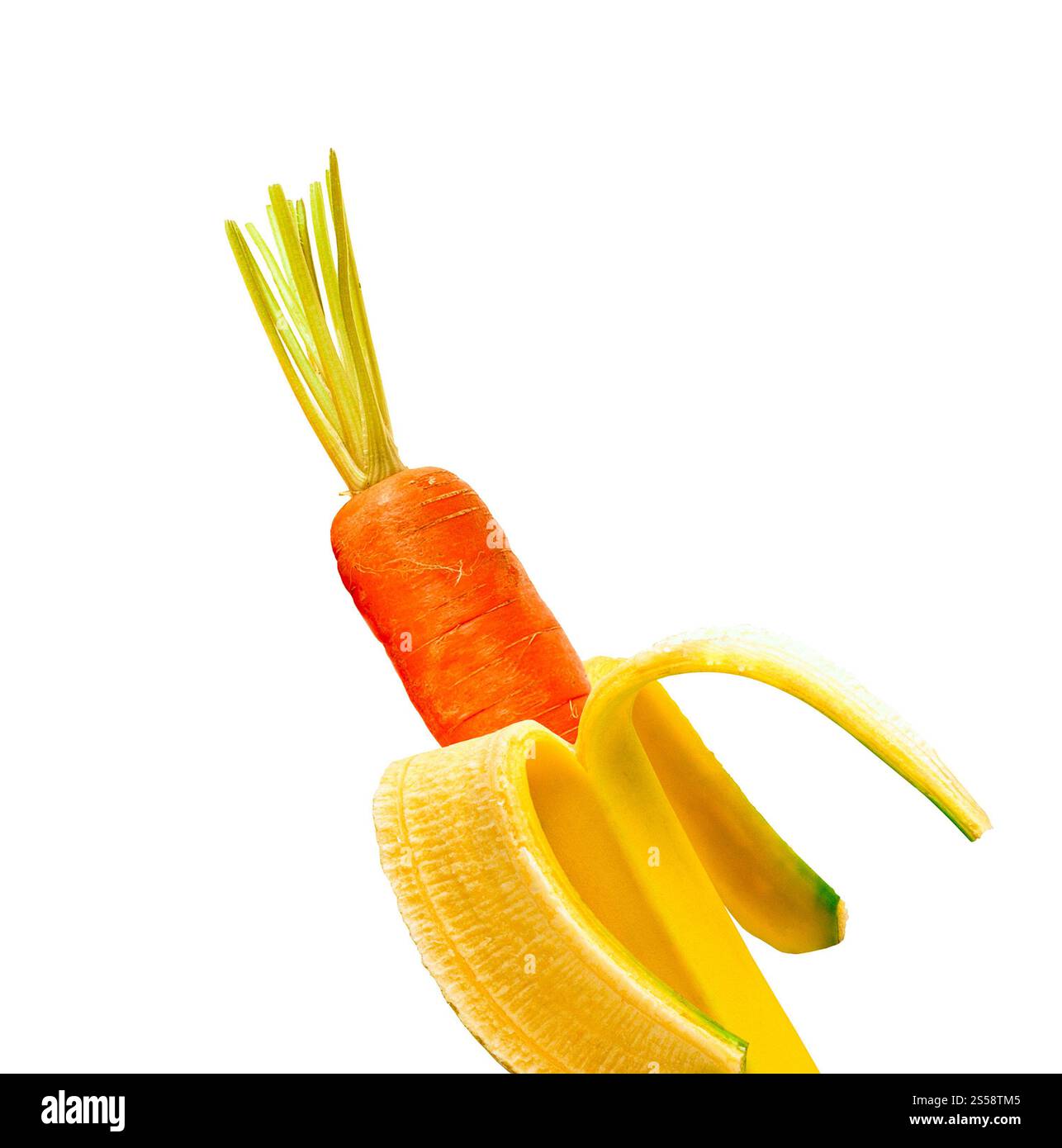 Carrot inside of banana isolated on white. Carrot inside of banana ...