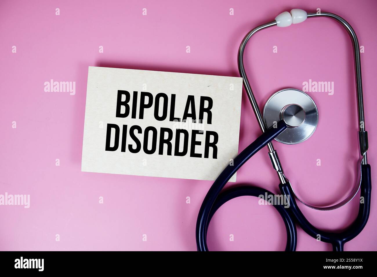 Bipolar Disorder text with stethoscope top view on pink background ...
