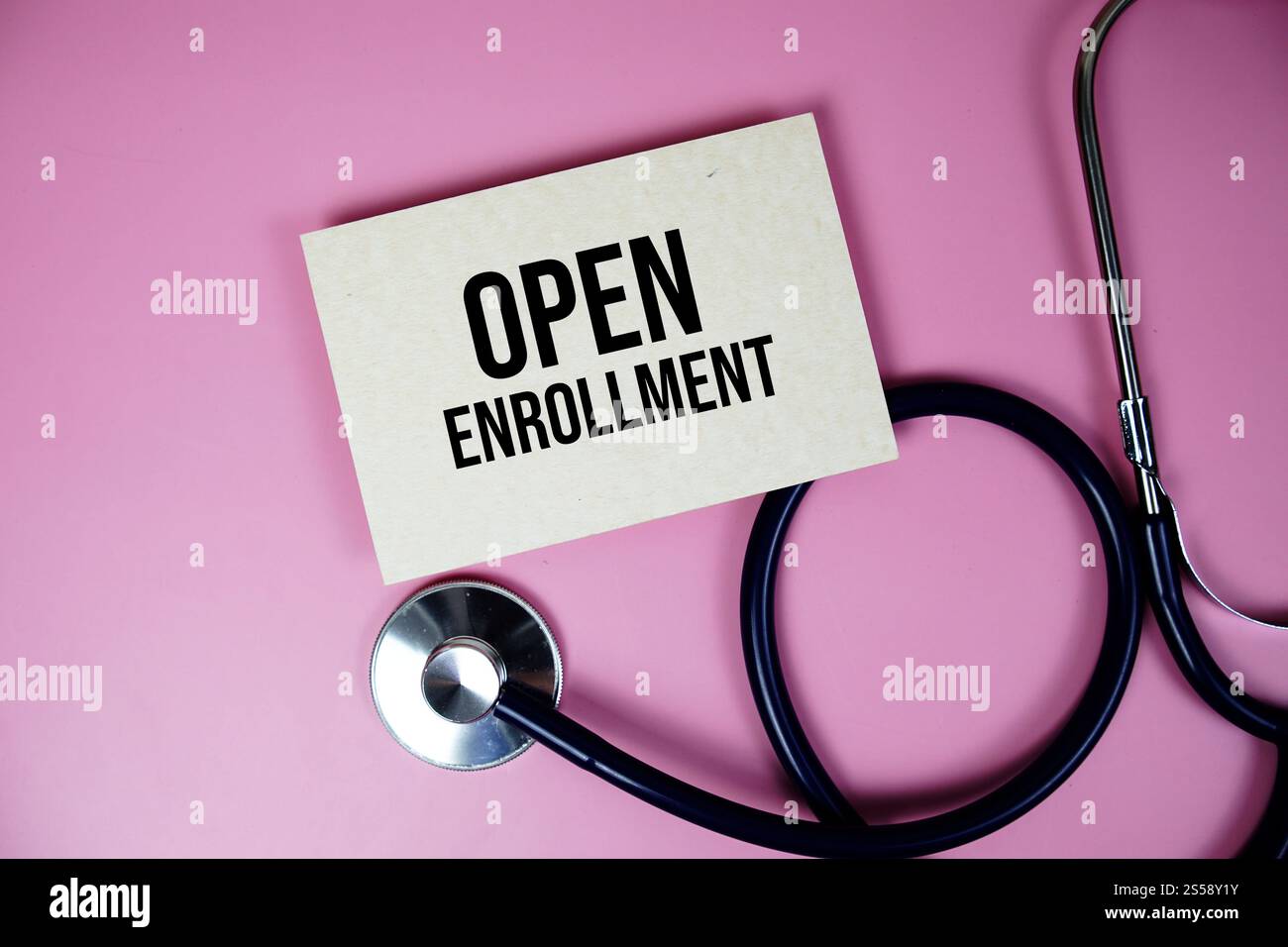 Open Enrollment text with stethoscope on pink background, Healthy and ...