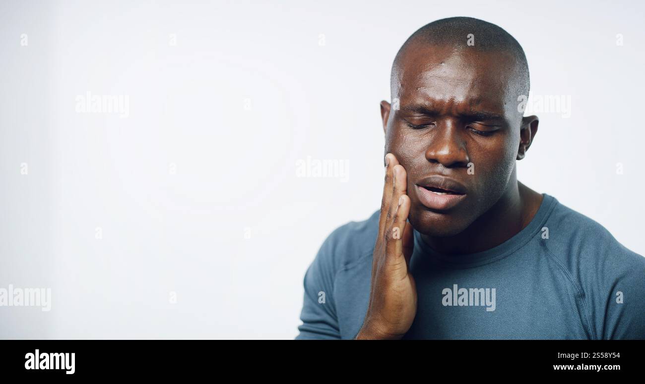 Hand, sick and black man with toothache in studio for dental injury ...