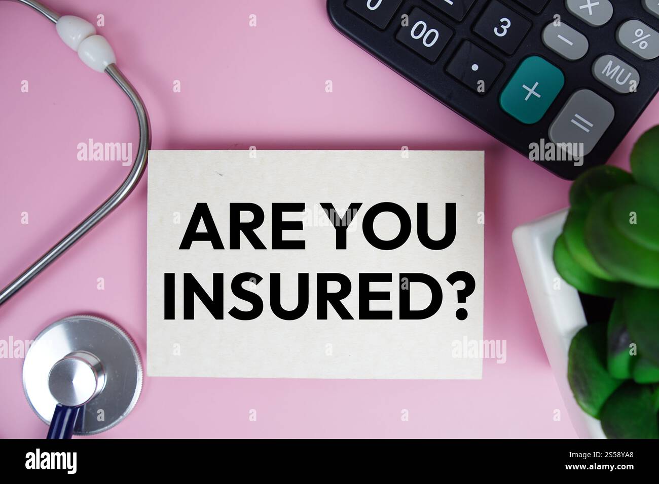 Are you insured? text with stethoscope top view on pink background ...