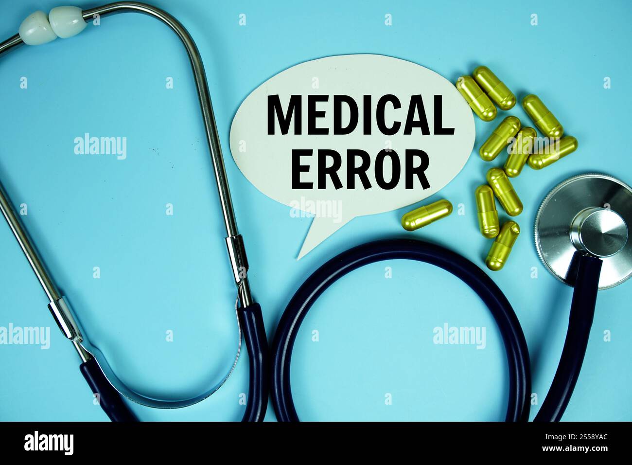Medical Error text with stethoscope and capsule medicine on blue ...