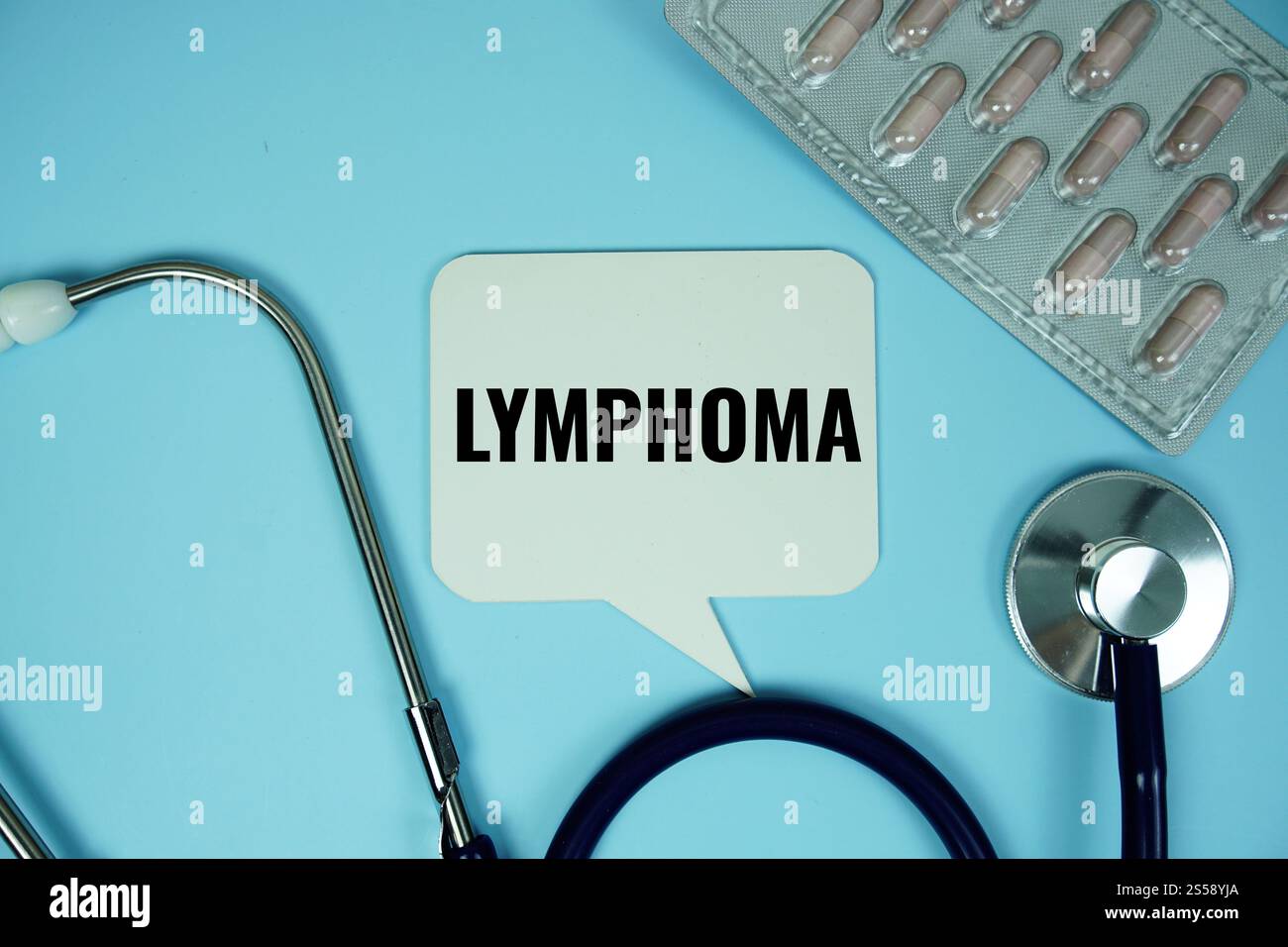 Lymphoma text with stethoscope and capsule medicine on blue background ...