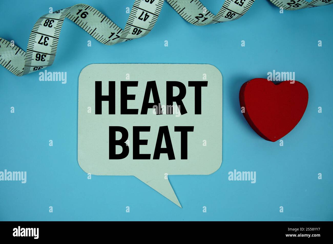 Heartbeat text on speech bubble with red heart and measure tape top ...