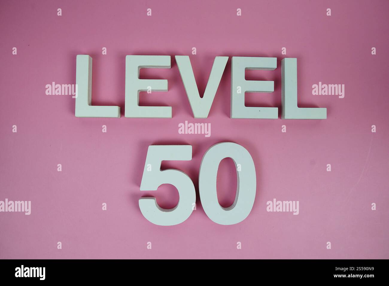Level 50 Level Fifty alphabet letters on pink background Stock Photo ...