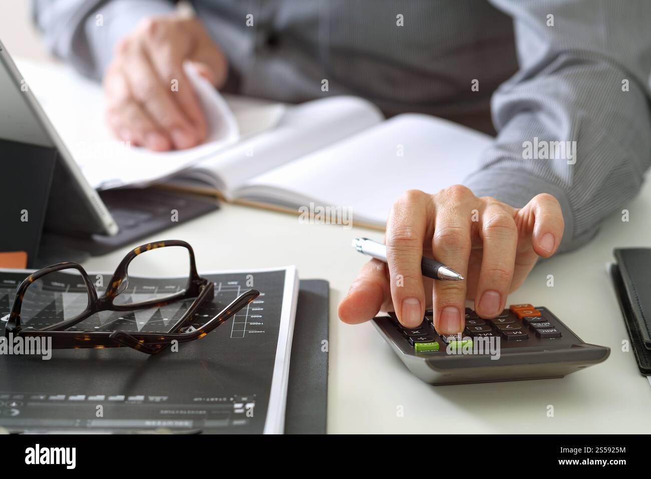 Businessman working with modern computer calculator virtual dashboard ...