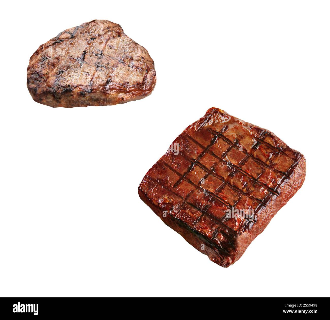 two grilled boneless rib eye steaks isolated on white background. two ...