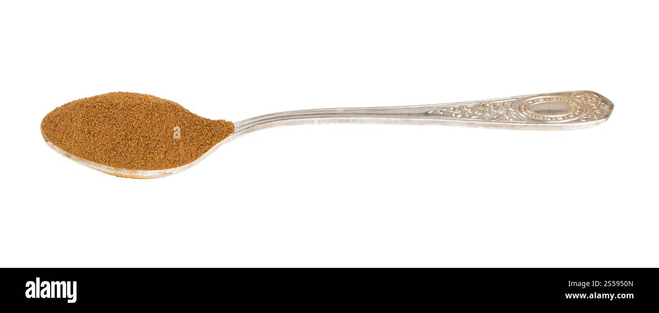 side view of soluble ground roasted chicory root powder in silver spoon ...