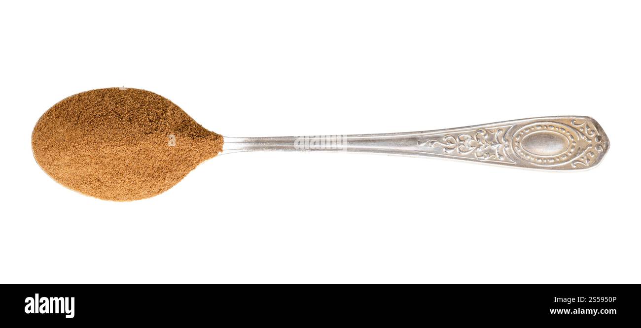 top view of soluble ground roasted chicory root powder in silver spoon ...