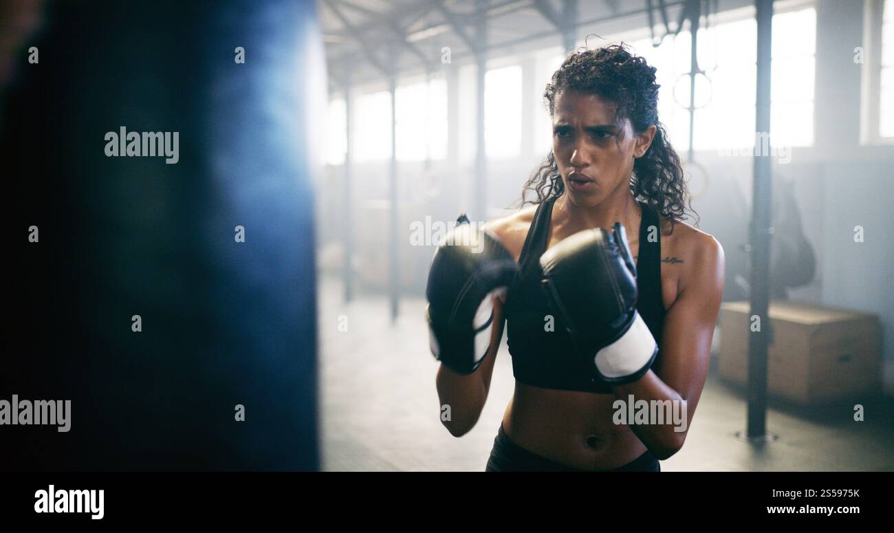 Sports, kickboxing and woman in gym for training with challenge ...