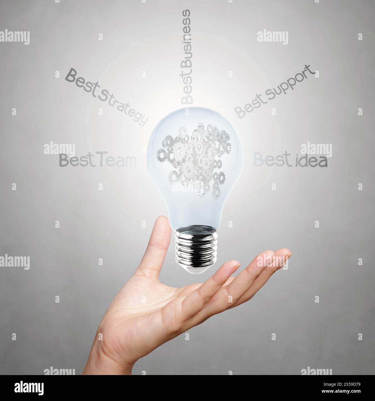 hand showing gear of creative business strategy with light bulb as ...